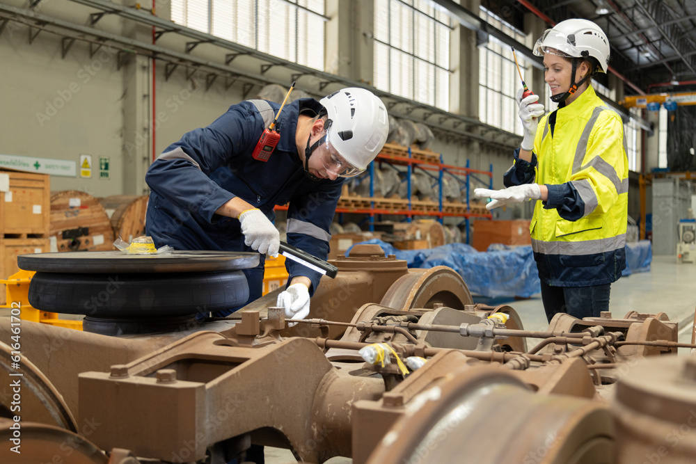 Engineer checks spare parts list and maintains mass transit locomotives ...