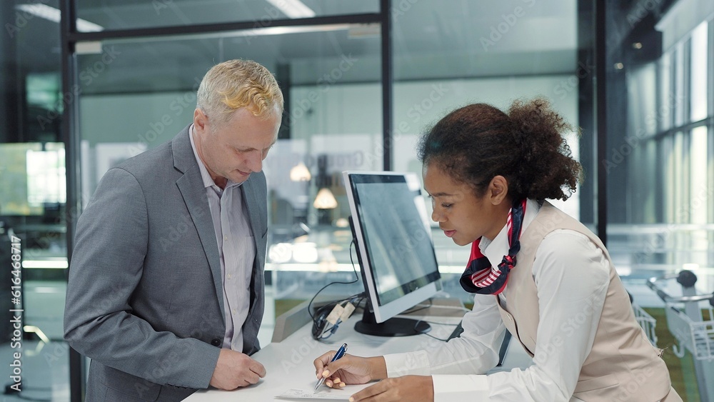 American african women airline ground staff worker giving boarding pass ...