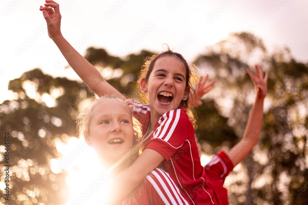Happy football team of tween girls celebrating together Stock Photo ...