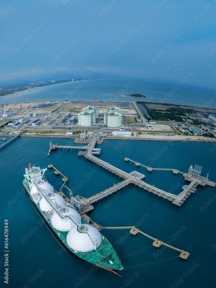 LNG (Liquified Natural Gas) tanker anchored in Gas terminal gas tanks ...