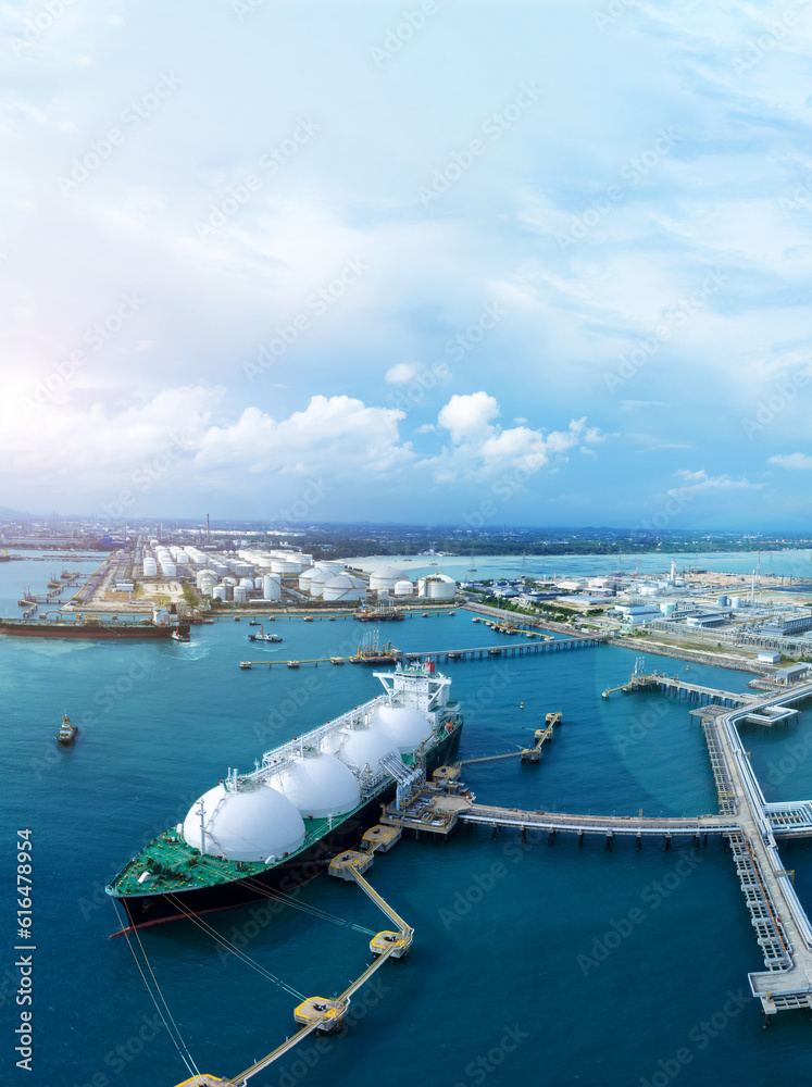LNG (Liquified Natural Gas) tanker anchored in Gas terminal gas tanks ...