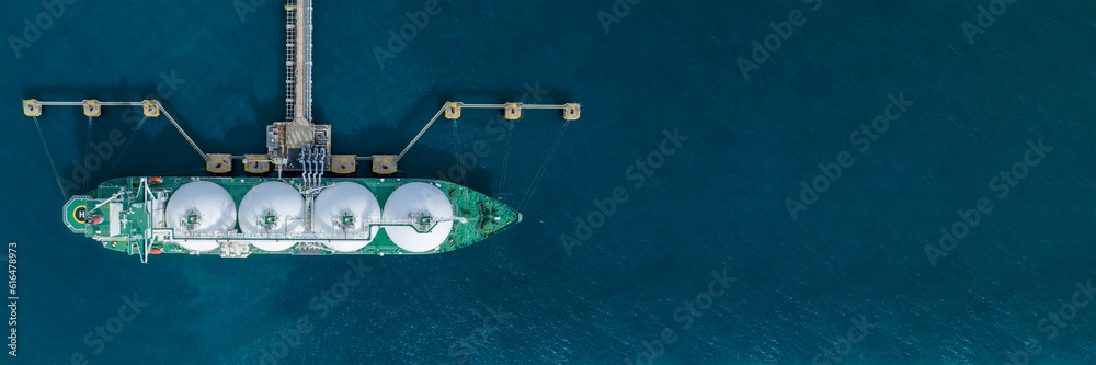 LNG (Liquified Natural Gas) tanker anchored in Gas terminal gas tanks ...