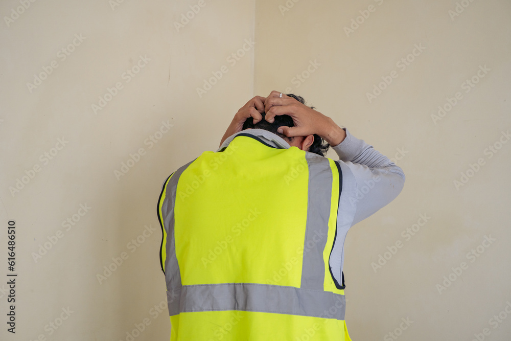 Young curly man wear worker wearpack with depression pose. The photo is ...