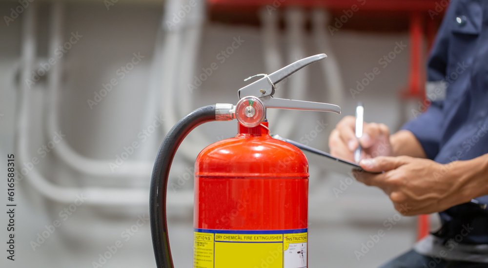 Engineer are checking and inspection a fire extinguishers tank in the ...