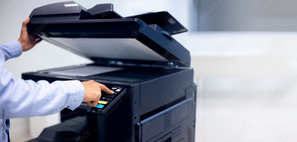 Bussiness man Hand press button on panel of printer, printer scanner ...