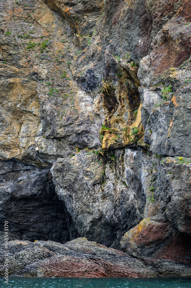 Fascinating geologic rock formation with a crying face on the cliff ...