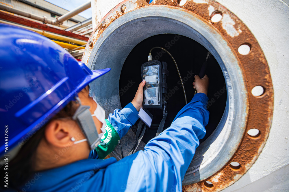 Worker female hand holding gas detector inspection safety gas testing ...