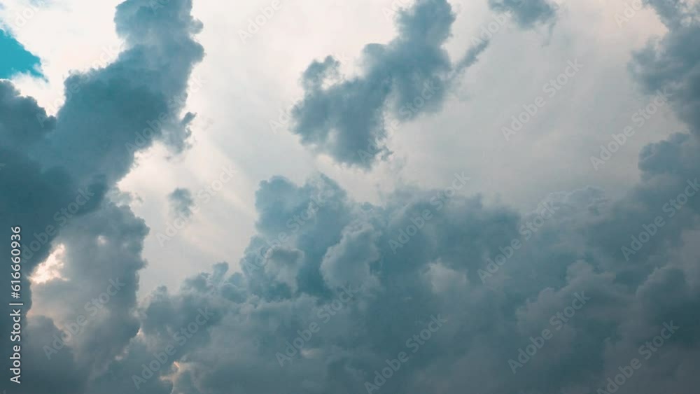 Beautiful clouds in the sky. Volumetric light effect. The sunrays are hidden behind the ...