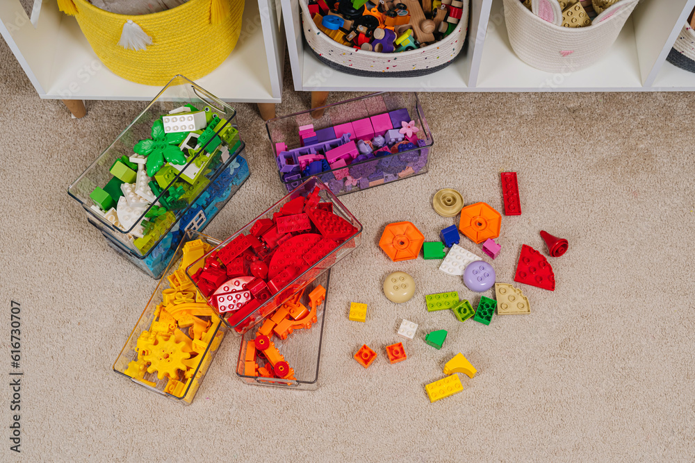 Foto de Colorful rainbow colored constructor pieces in transparent ...