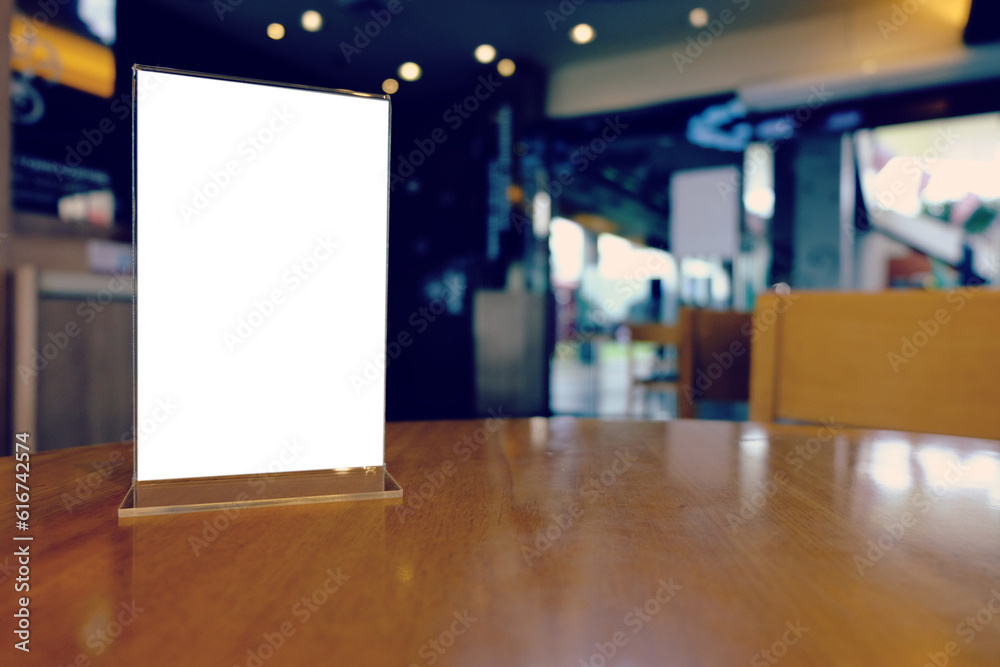 Mock up Menu frame standing on wood table in Bar restaurant cafe. space ...