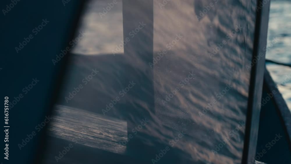 Waves reflecting on glass screen of a motorboat. Sea cruise voyage in ...
