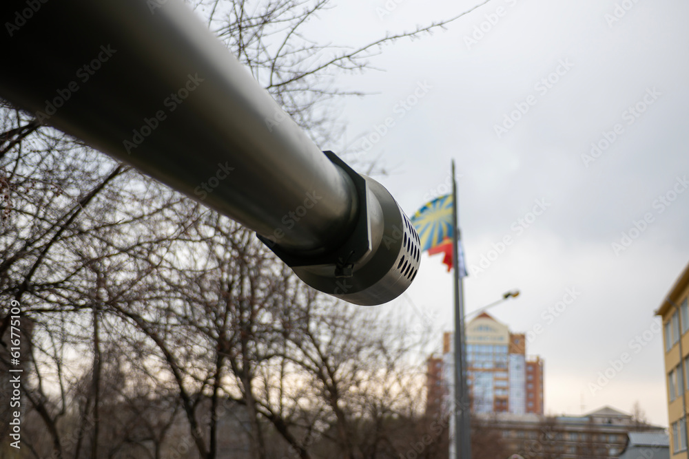 Muzzle brake of a gun at a military base in the city. Stock Photo ...