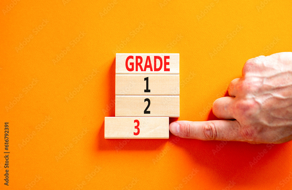 Time to grade 3 symbol. Concept word Grade 1 2 3 on wooden block ...