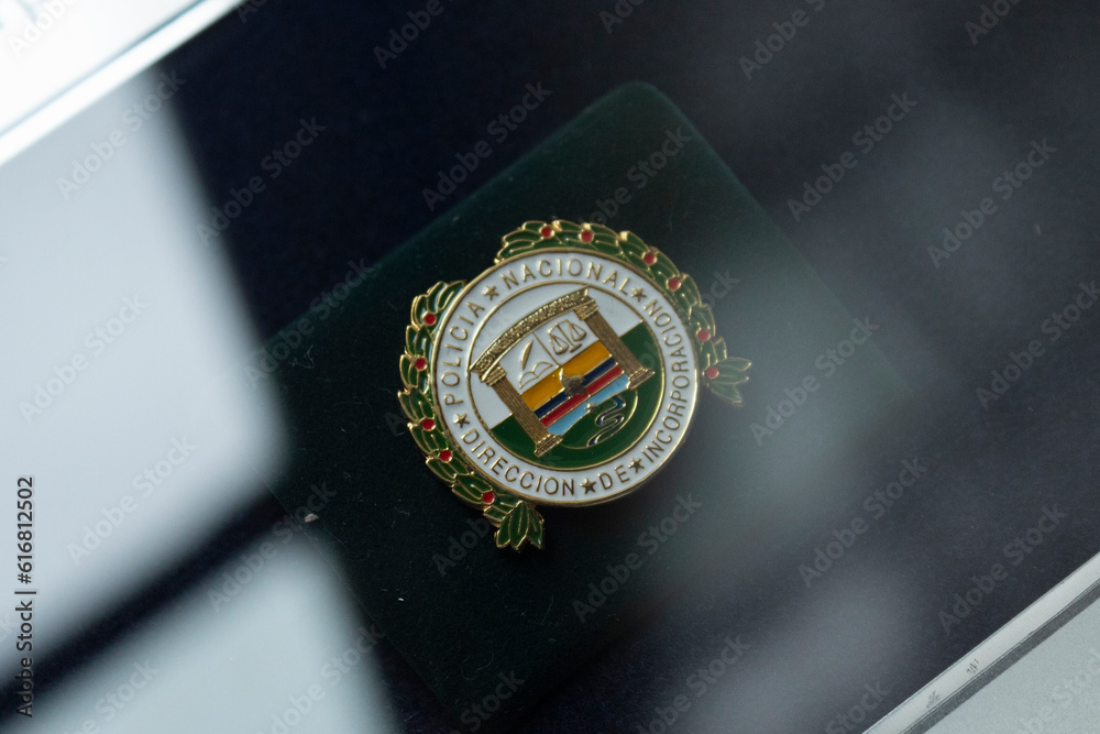 BOGOTA, COLOMBIA Colombian police smal metallic pin into a showcase at ...