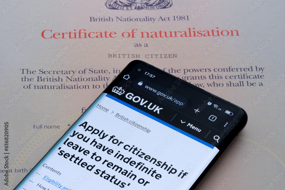Smartphone with Citizenship online application page placed on top of ...