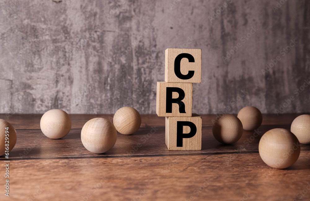 CRP - C-Reactive Protein Test symbol. Wooden cubes with word CRP ...