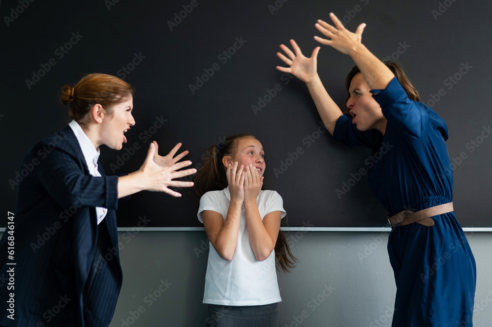 A female teacher and a student's mother yell at each other at the ...