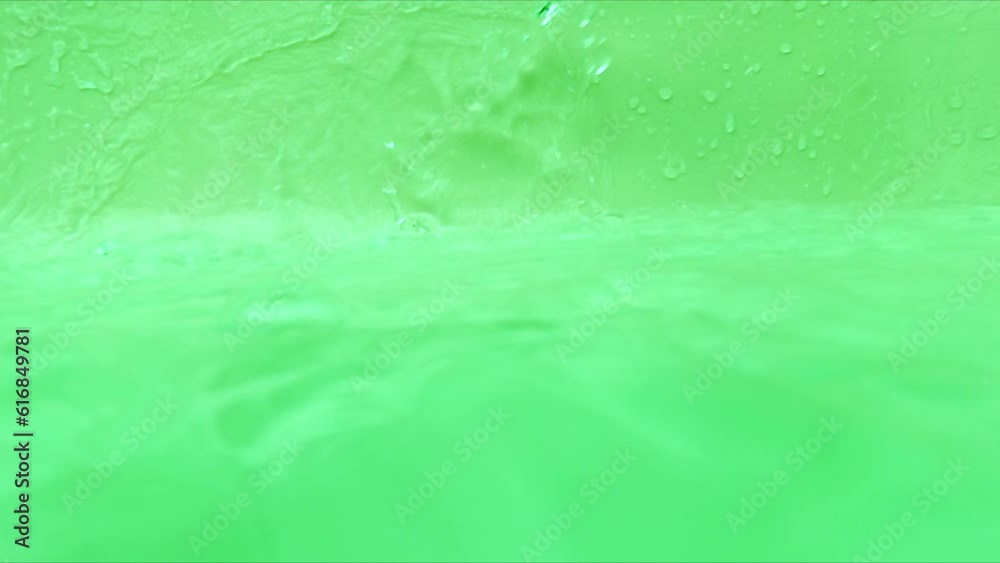 Green water with ripples on the surface. Defocus blurred transparent ...