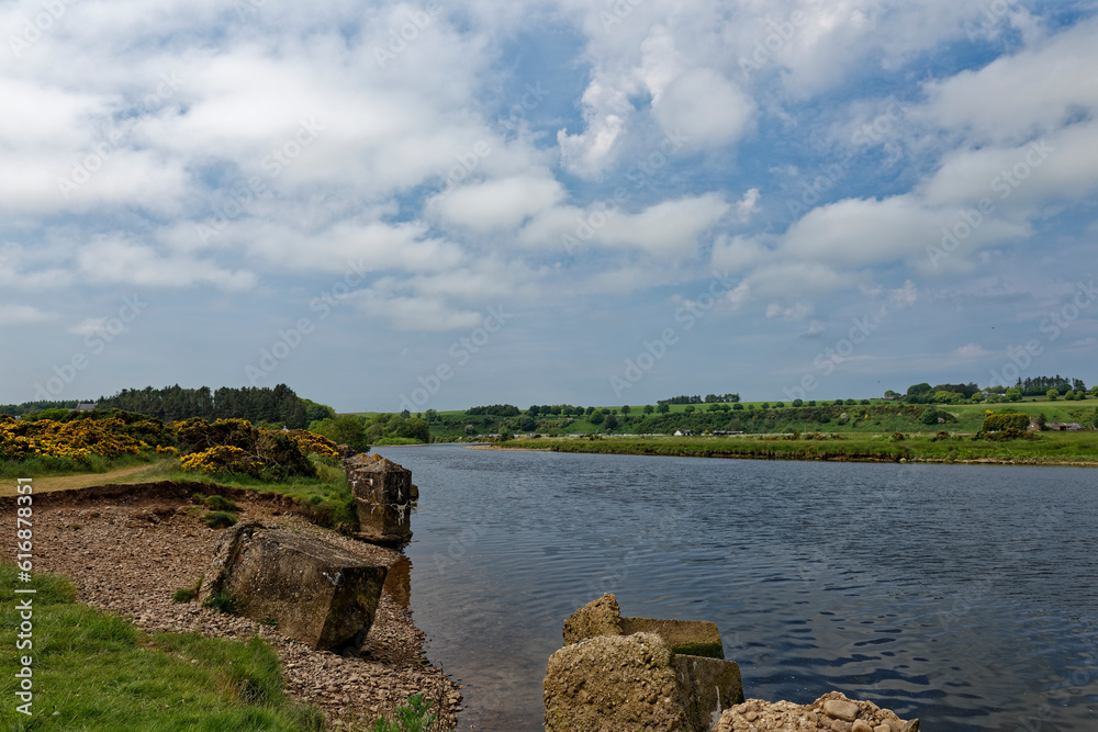 Toppled Wartime Tank Traps line the bank of the River North Esk near to ...