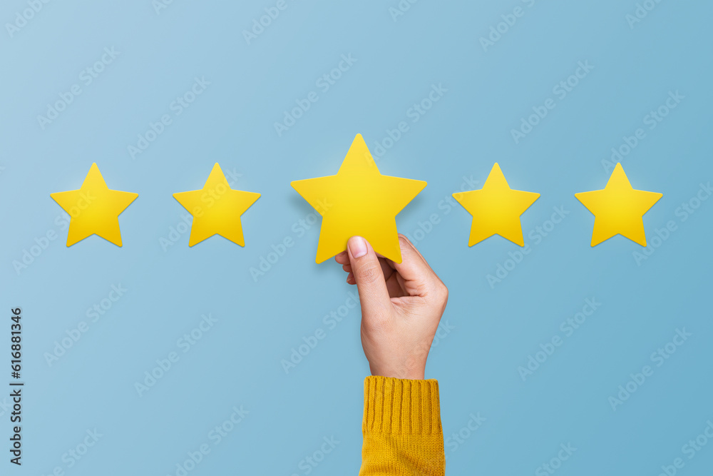 Hand putting star icon for giving five star rating. Improve rating ...