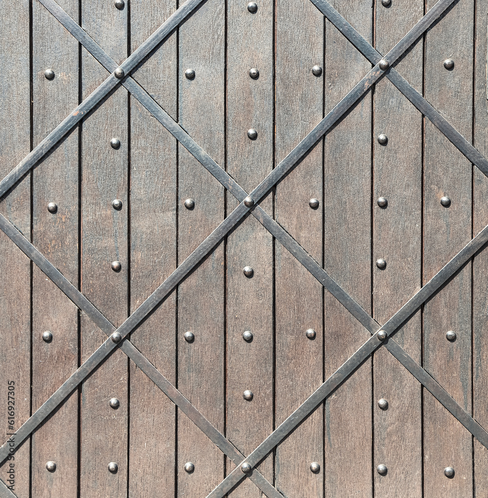 Texture of an old-fashioned wooden gate with button-head rivets and ...
