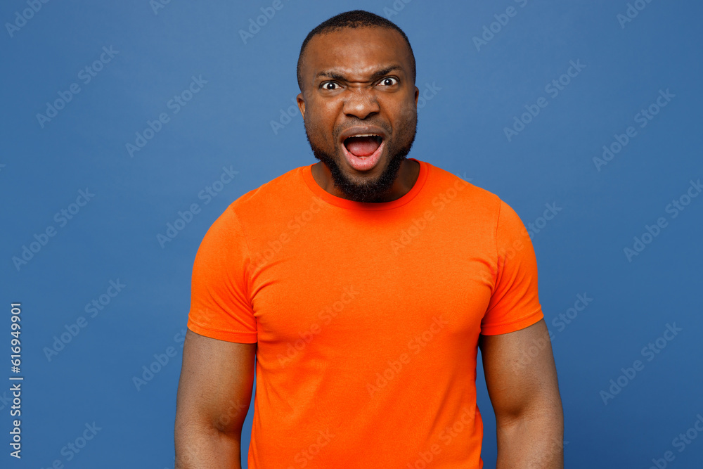 Young sad mad angry furious man of African American ethnicity he ...