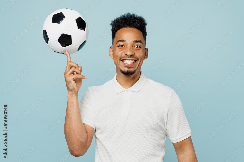 Young smiling man fan wear basic t-shirt cheer up support football ...