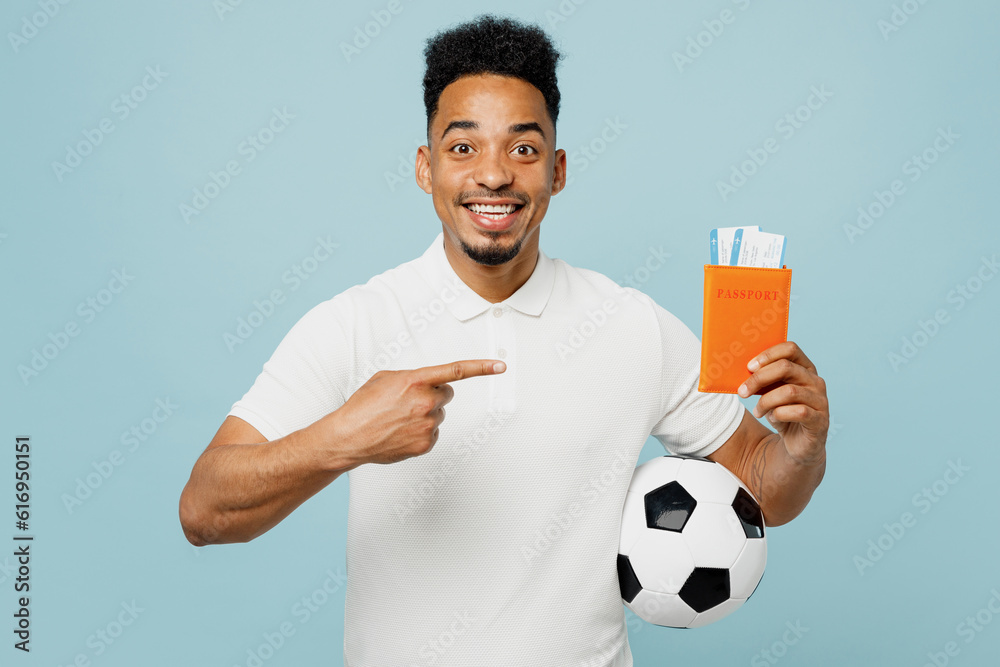 Traveler young man fan wear t-shirt cheer up support football sport ...