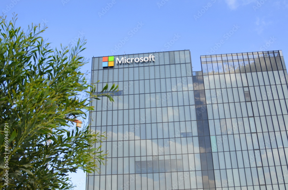 Microsoft sign on the office building. Logo Microsoft research and ...