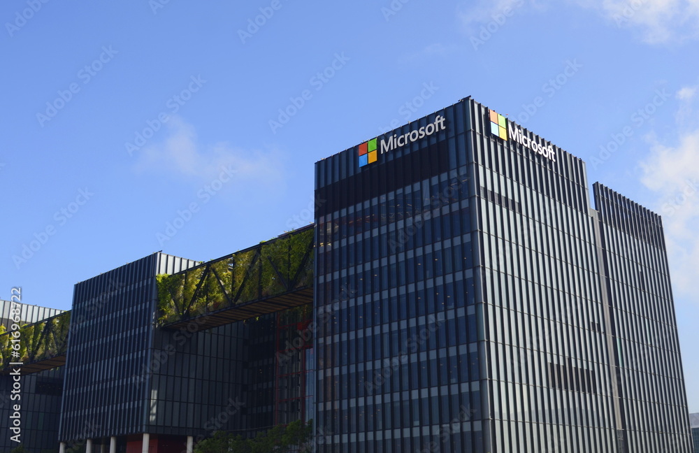 Microsoft sign on the office building. Logo Microsoft research and ...