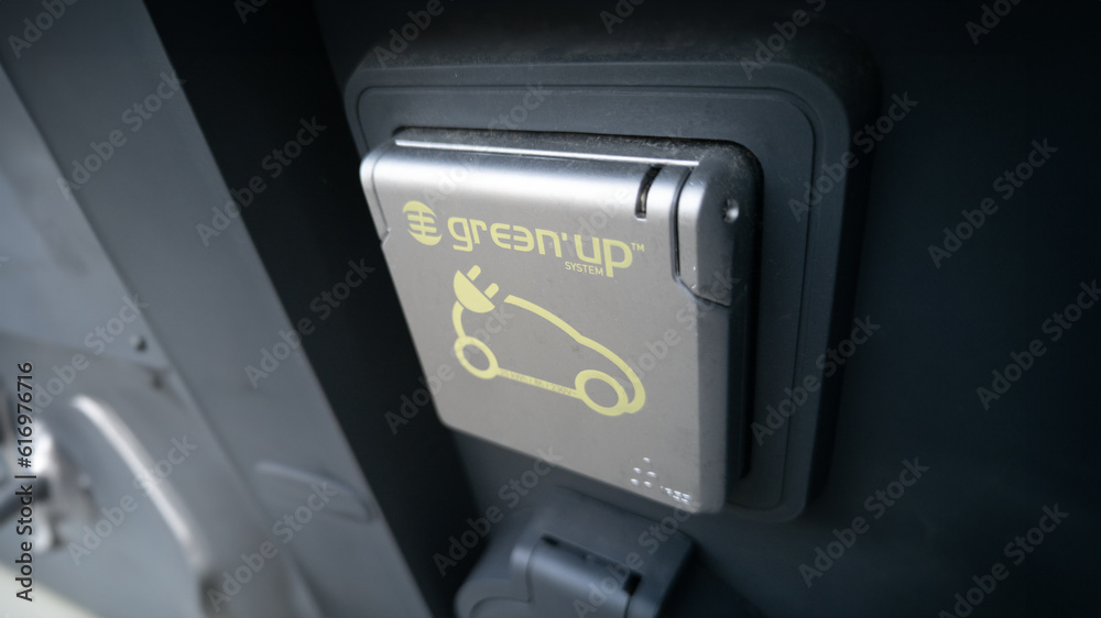 June 2023 in France, Close up on a plug for recharging an electric car ...