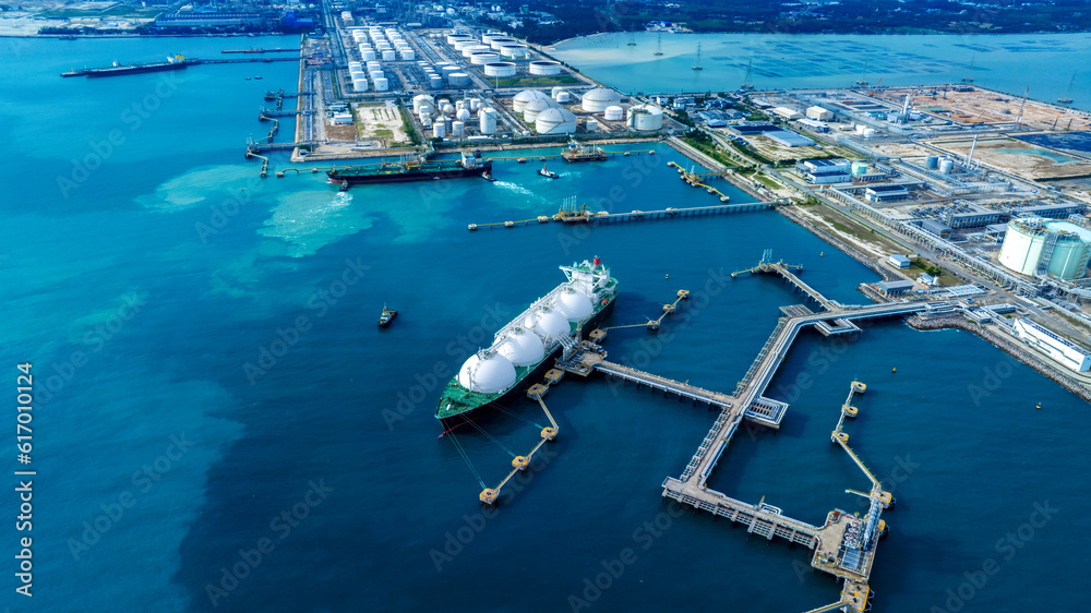 LNG (Liquified Natural Gas) tanker anchored in Gas terminal gas tanks ...