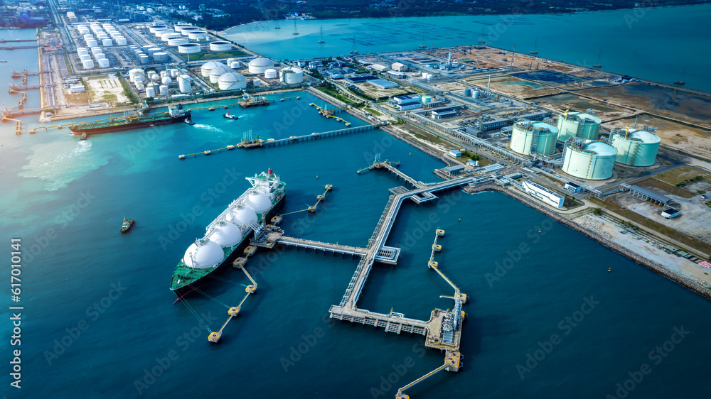 LNG (Liquified Natural Gas) tanker anchored in Gas terminal gas tanks ...