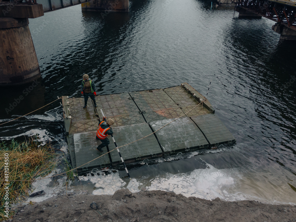 Pontoon bridge of the Ukrainian army. Installation of a temporary ...