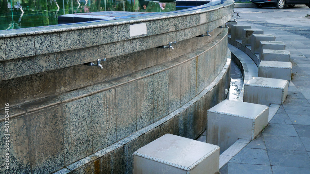 Foto de a row of water faucets for ablution (wudhu). Cleansing room ...