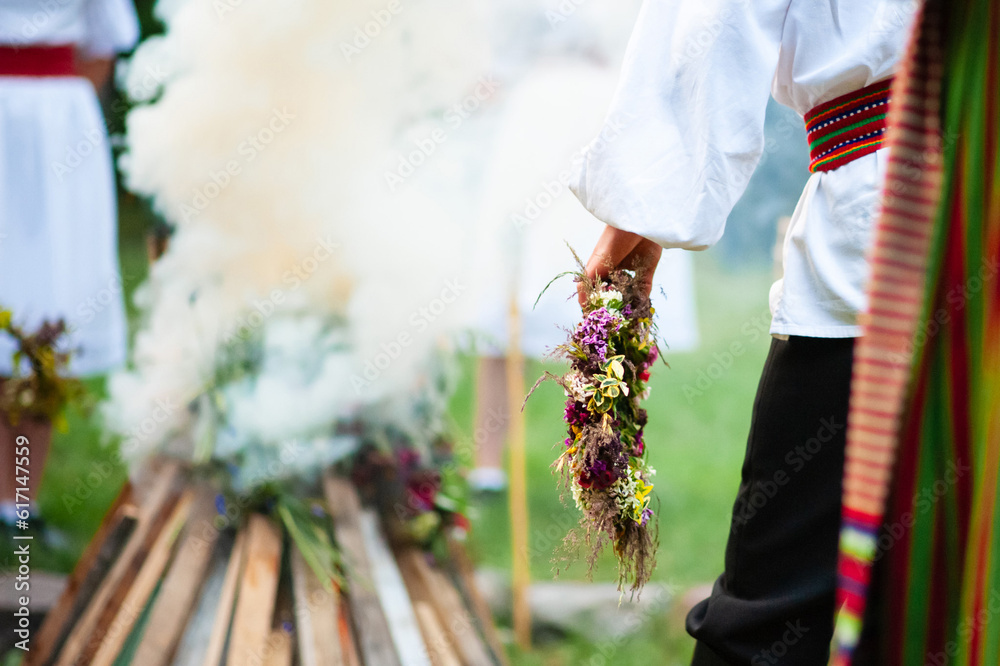 People around a campfire celebrating the midsummer summer solstice ...