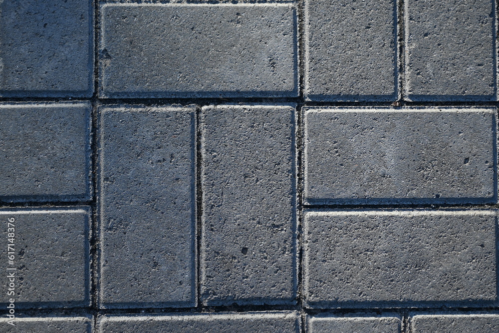 grey paving slabs as a background, symmetrical paving slabs close up ...