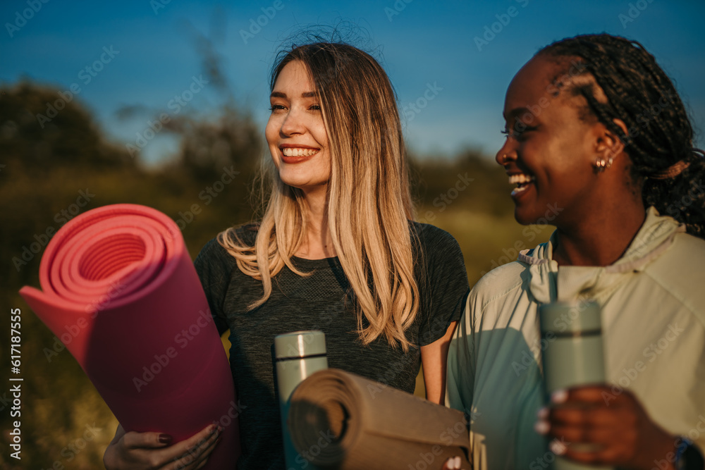 Unity in Nature: Against a backdrop of vibrant foliage, two women of ...
