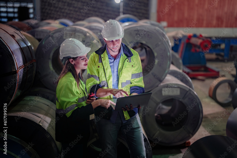 Professional engineering workers walk and check in warehouse factory ...