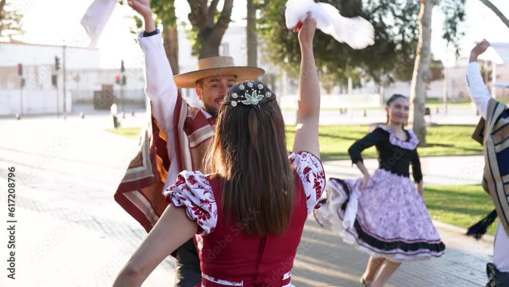 mixed group of four people dressed as huaso dancing cueca in the town ...