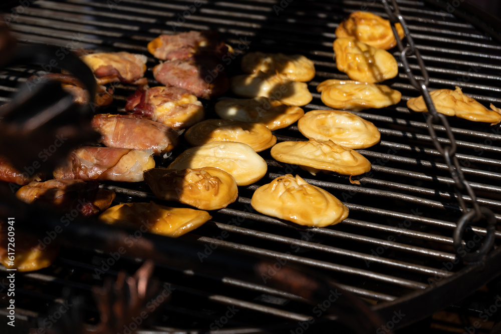 Oscypki grilled on barbecue. Oscypek salted sheep milk smoked cheese ...
