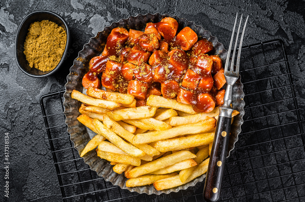 German fastfood currywurst meal, curry wurst with french fry. Black ...