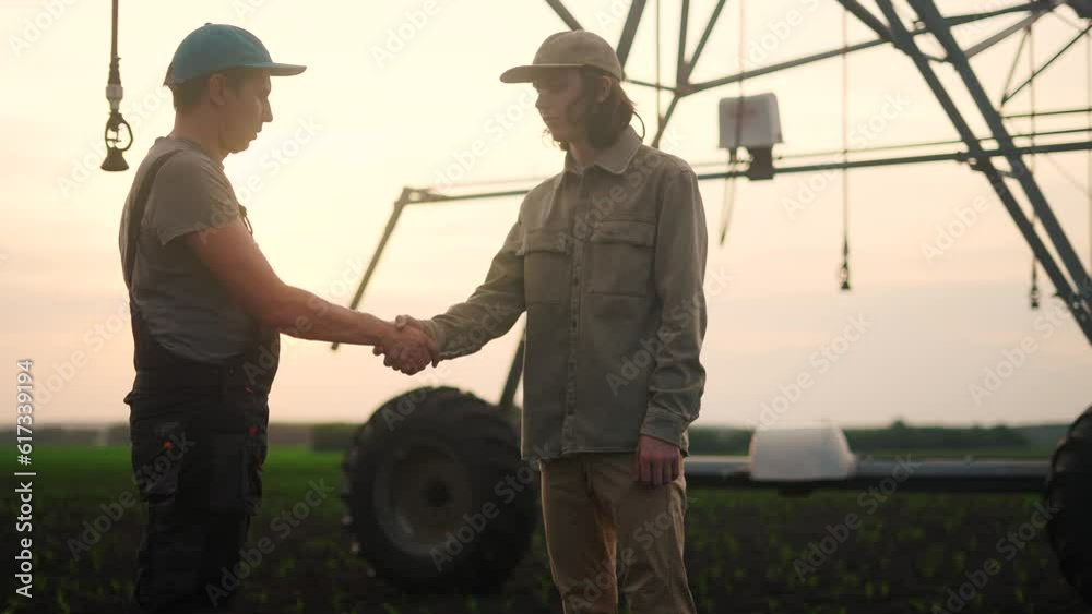 agriculture farmers. two farmers shaking hands. agriculture irrigation ...