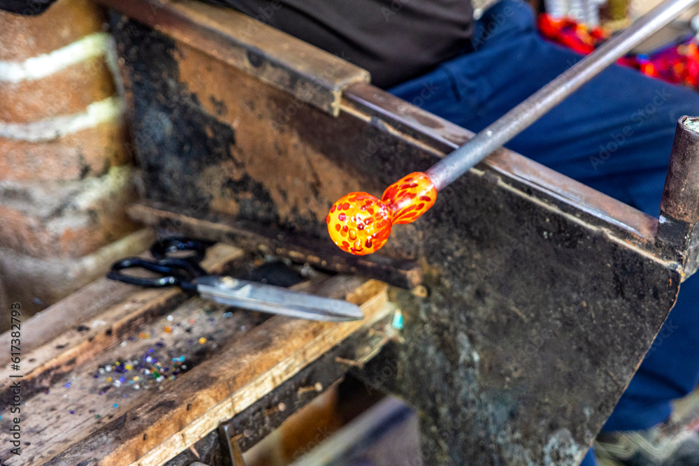 Glass in fusing temperature blowing to make a bottle with the old ...