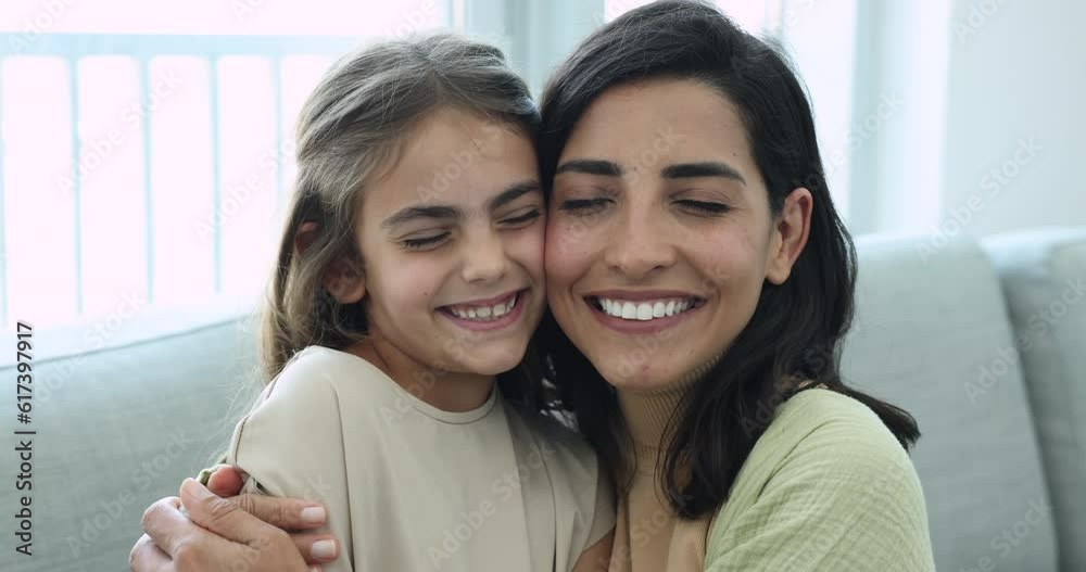 Happy loving mother and little daughter cheeks touching while cuddling ...
