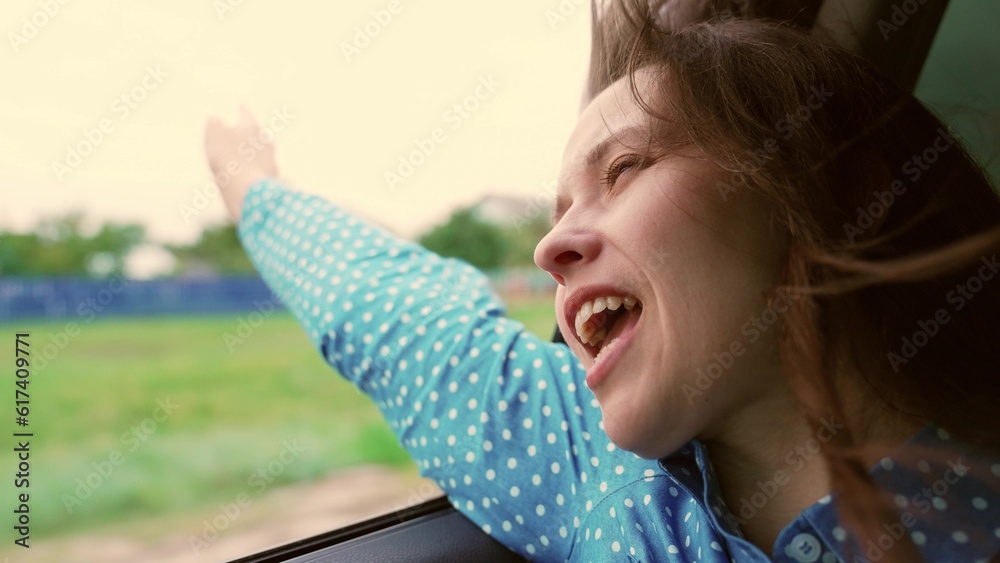 Fotografia do Stock: happy girl rides with her hand out window, car ...