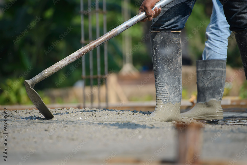 Workers Legs were pouring concrete in construction site. Poor Labor ...