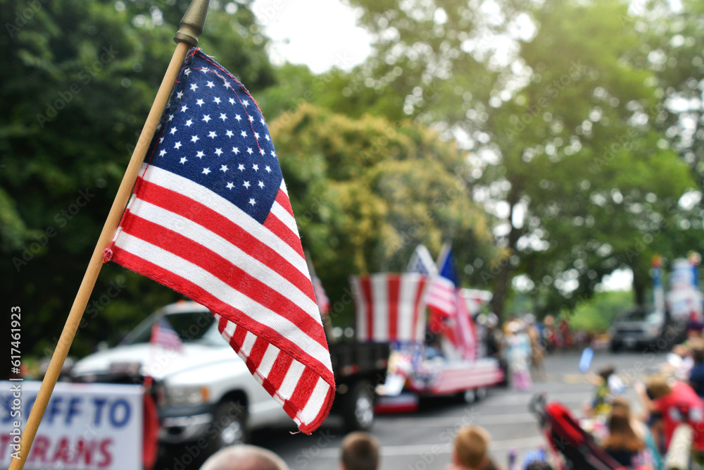 Waving an American flag at the Independence Day Parade on the 4th of ...