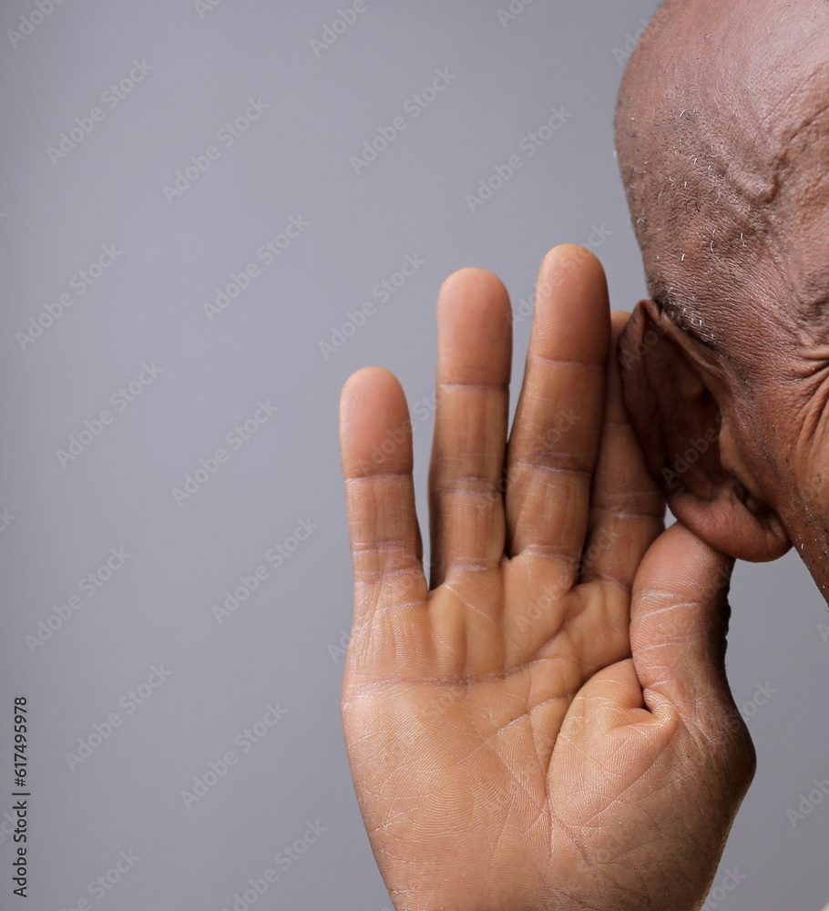 deaf man suffering from deafness and hearing loss on grey background ...