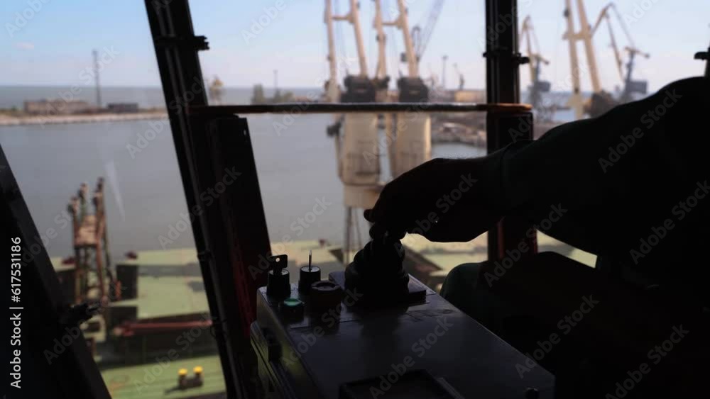 Man hands control joysticks at grain terminal operator cabin workplace ...